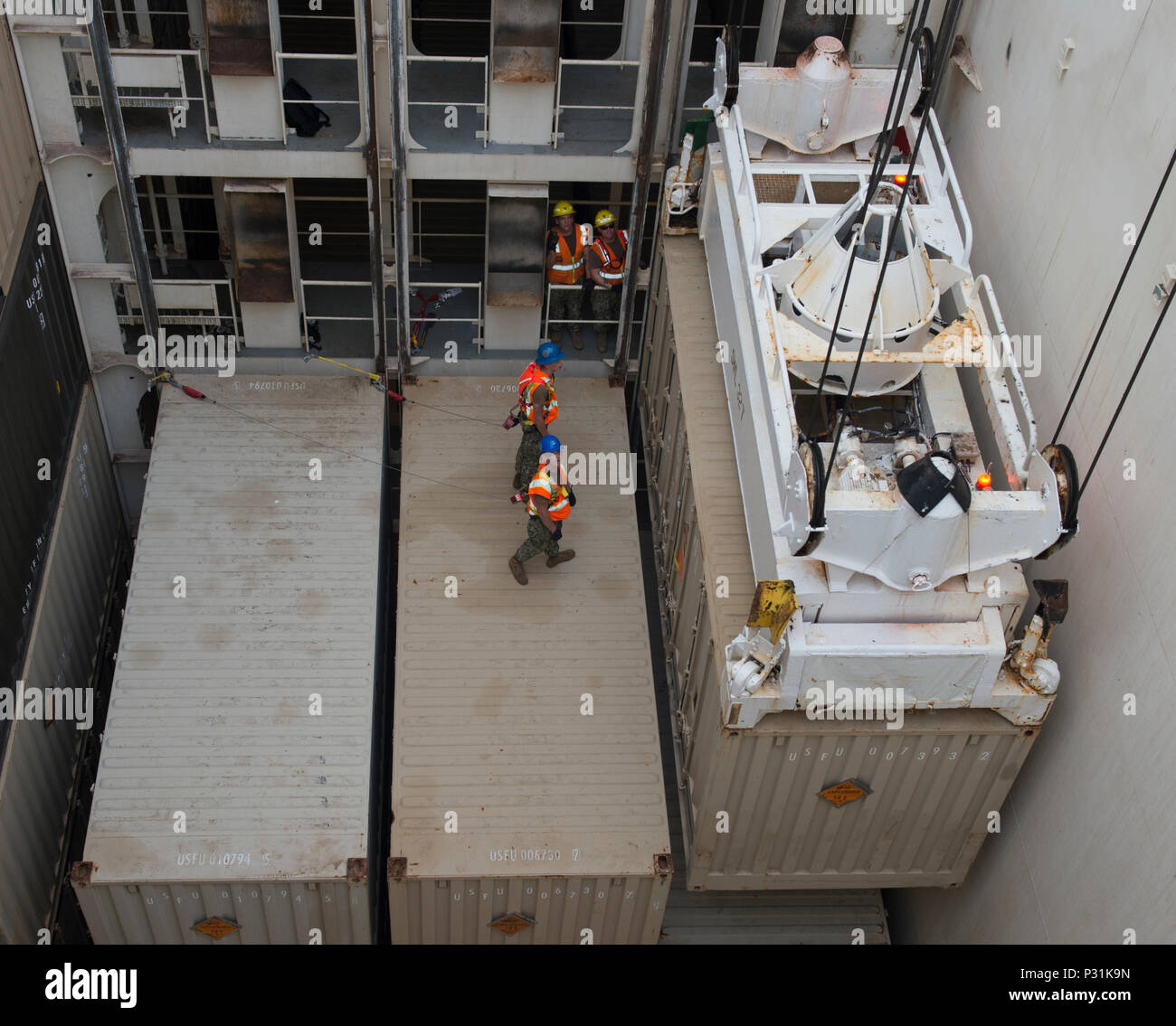 Sailors assigned to Navy Cargo Handling Battalion (NCHB) 1 assist with ...
