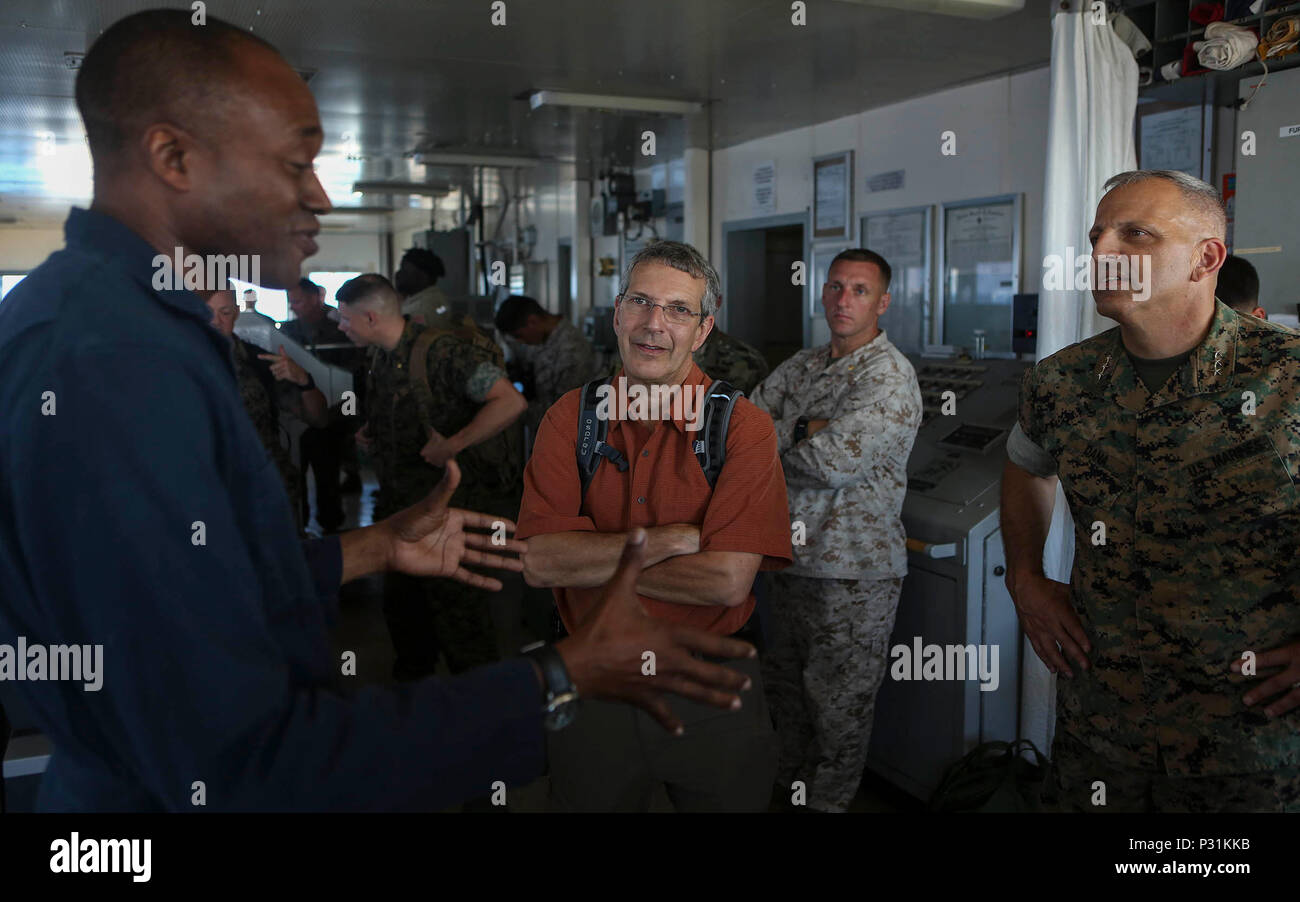 Fred Walley, Captain of the SS Wright (T-AVB 3), left, speaks with The ...