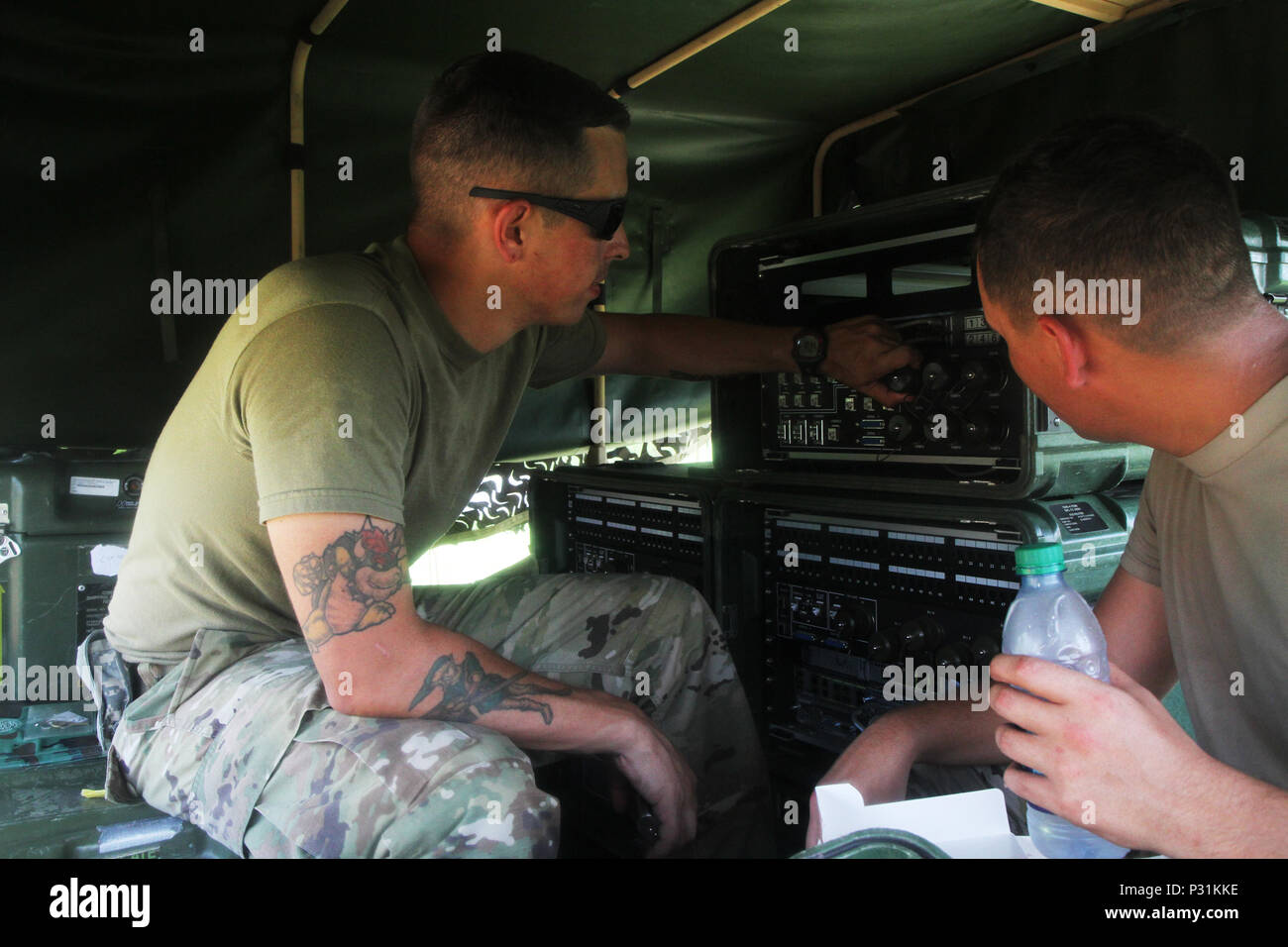 Sgt. Christopher Mefford (left), a Joint Network Node team leader, and ...