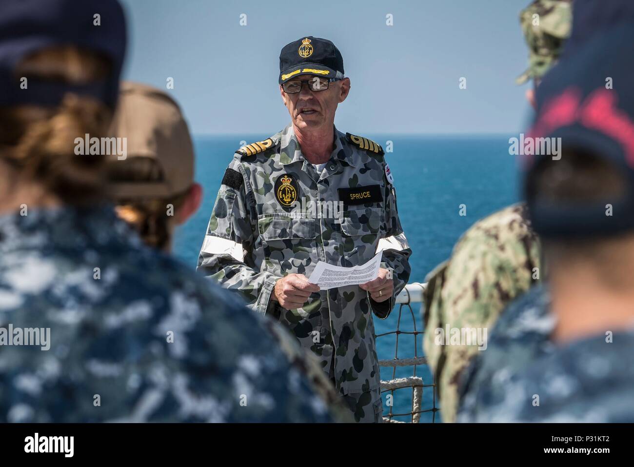 Royal Australian Navy Captain Mike Spruce, addresses Australian and U.S ...