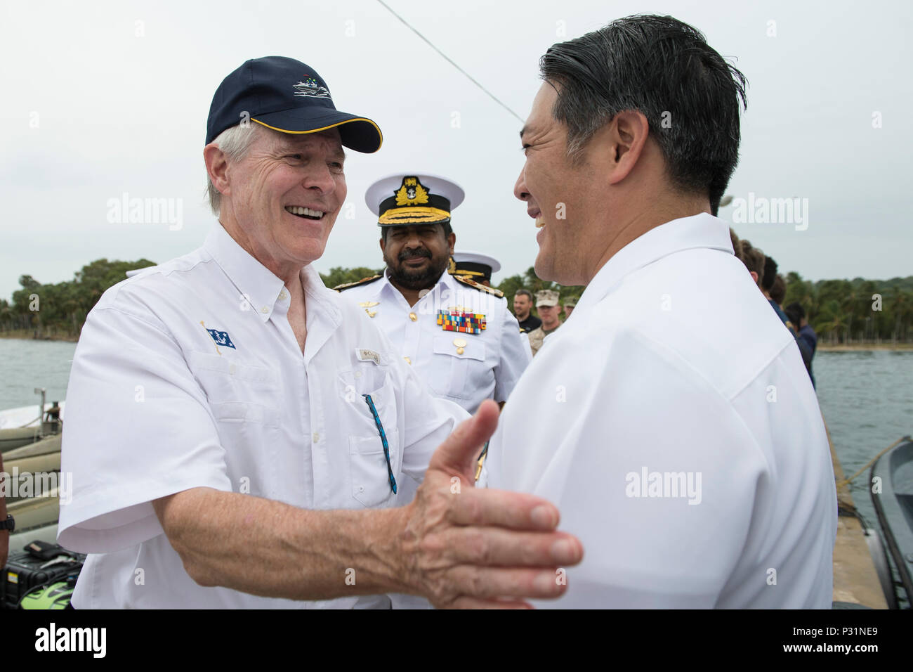 The Secretary of the Navy shakes hands with a Senior Chief EOD ...