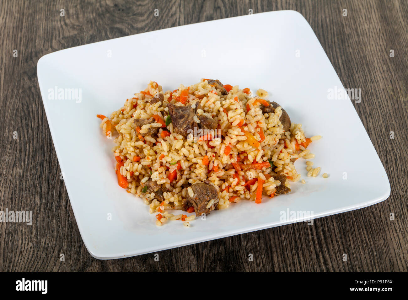 Asian rice - Plov with meat and carrot Stock Photo - Alamy