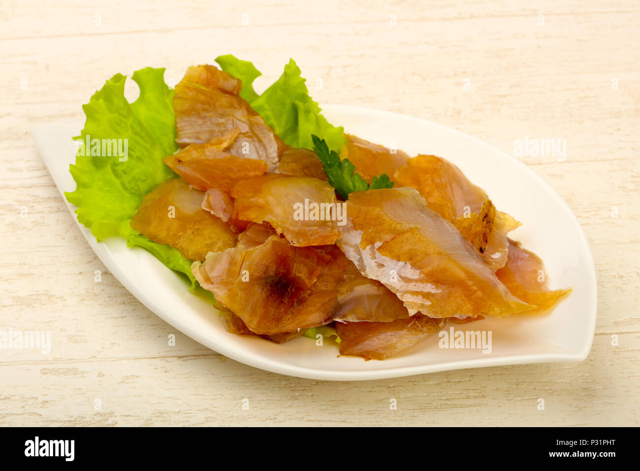 Smoked catfish fillet carpaccio Stock Photo - Alamy