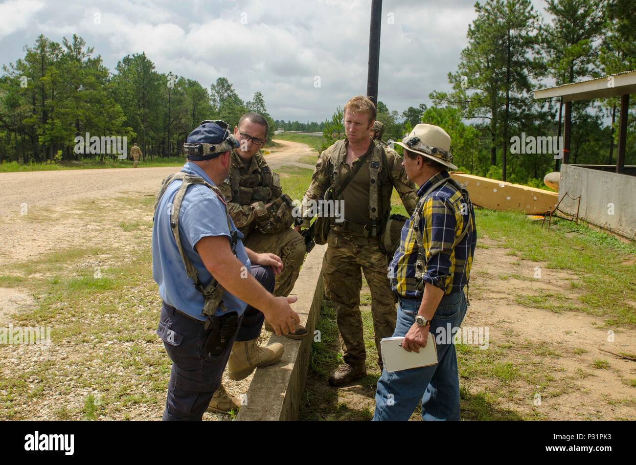 (L-R) The 'Atropian' police chief, Capt. Brian Delgado, battalion ...