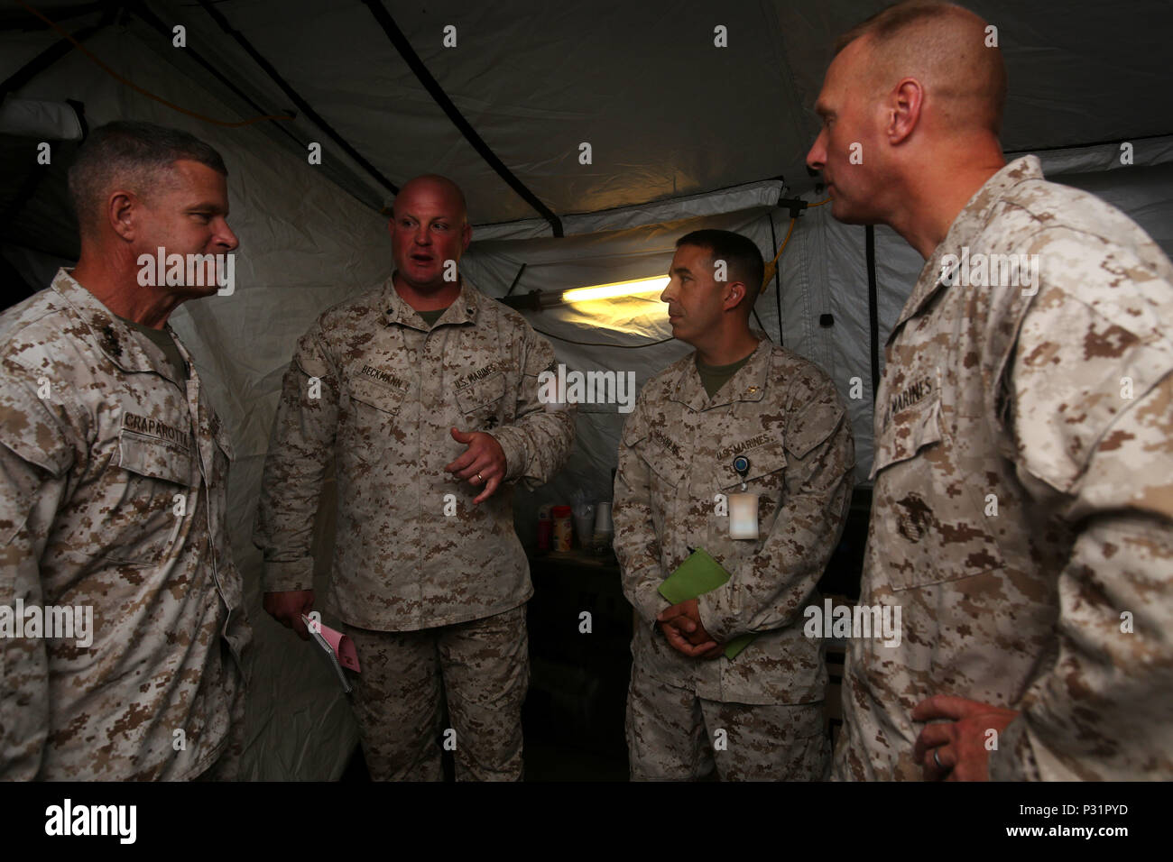 U.S. Marine Lt. Col. Eric Beckmann (center left) speaks to Lt. Gen ...