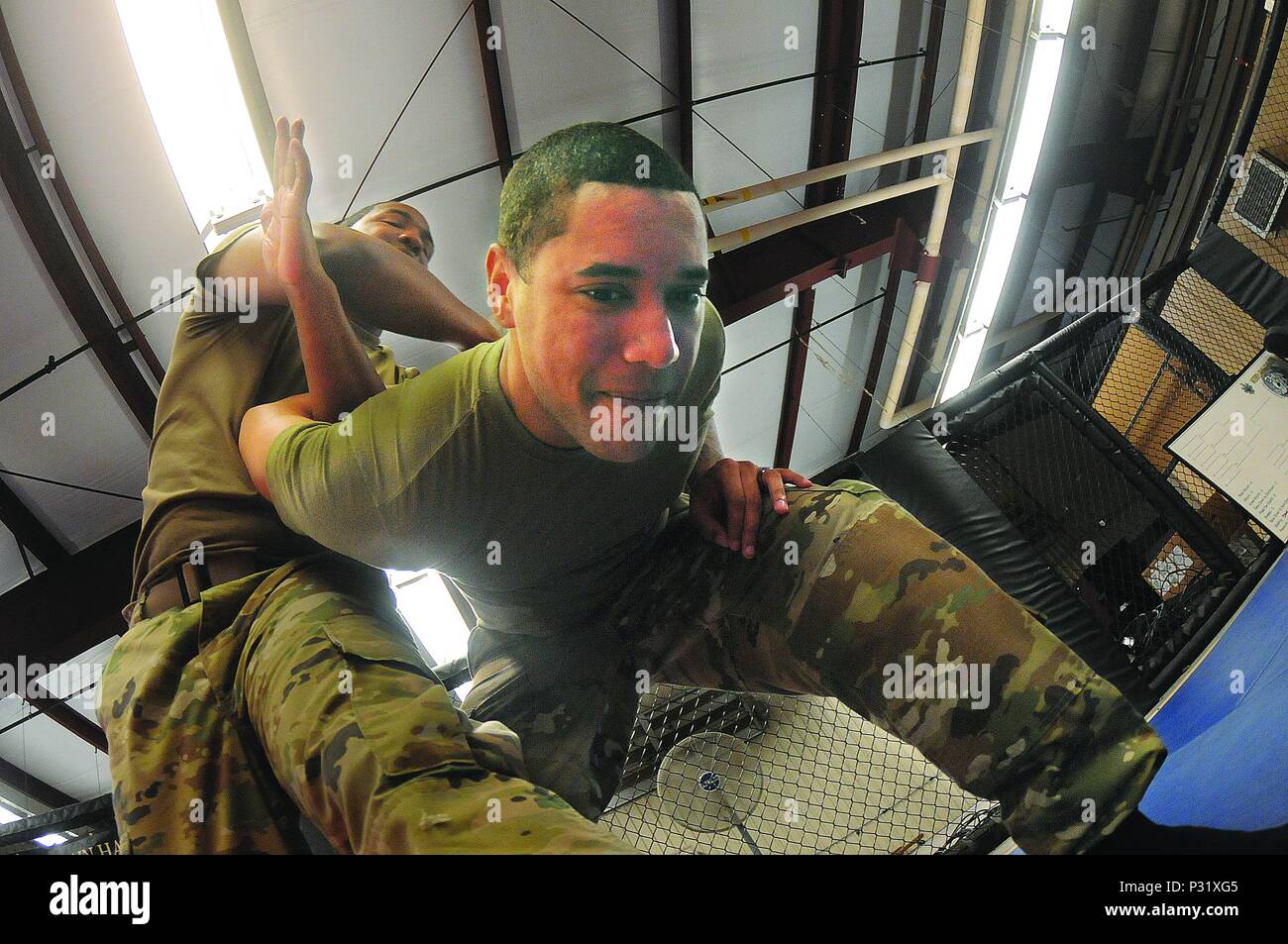 Spc. Alton Mickle subdues fellow military policeman Spc. Kenneth ...