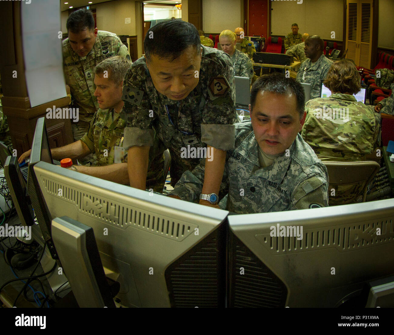 U.S. Army Lt. Col. Troy Ellis (right), the deputy of civil military ...