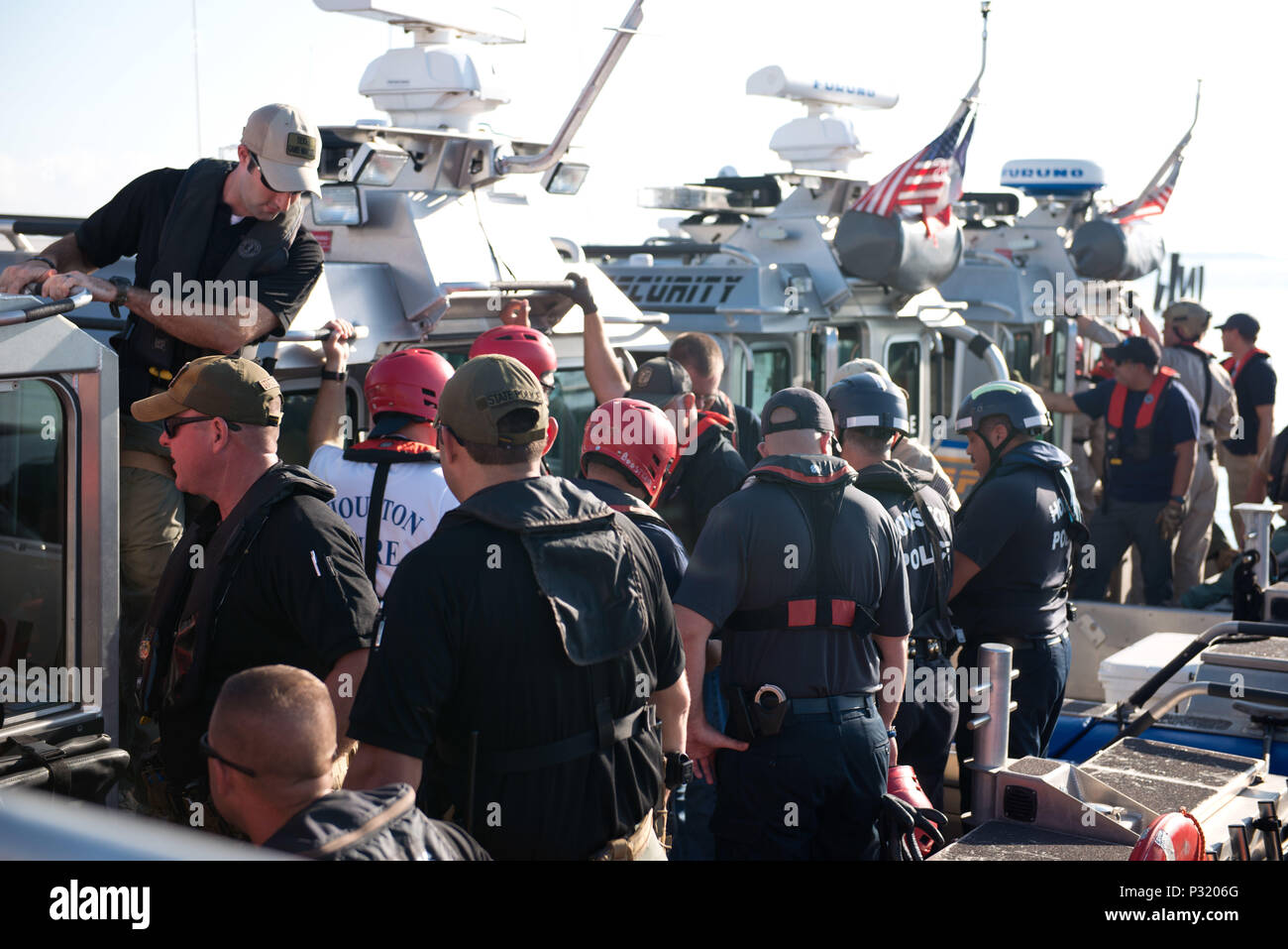 Members of the Maritime Tactical Operations Group board Coast Guard and ...