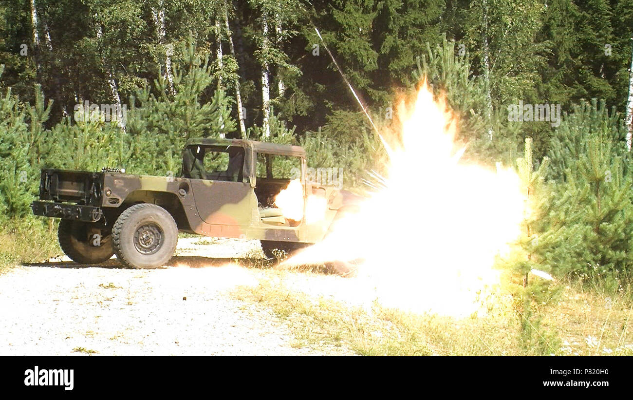 The selectable Lightweight Attack Munition (SLAM) fires at a target at ...