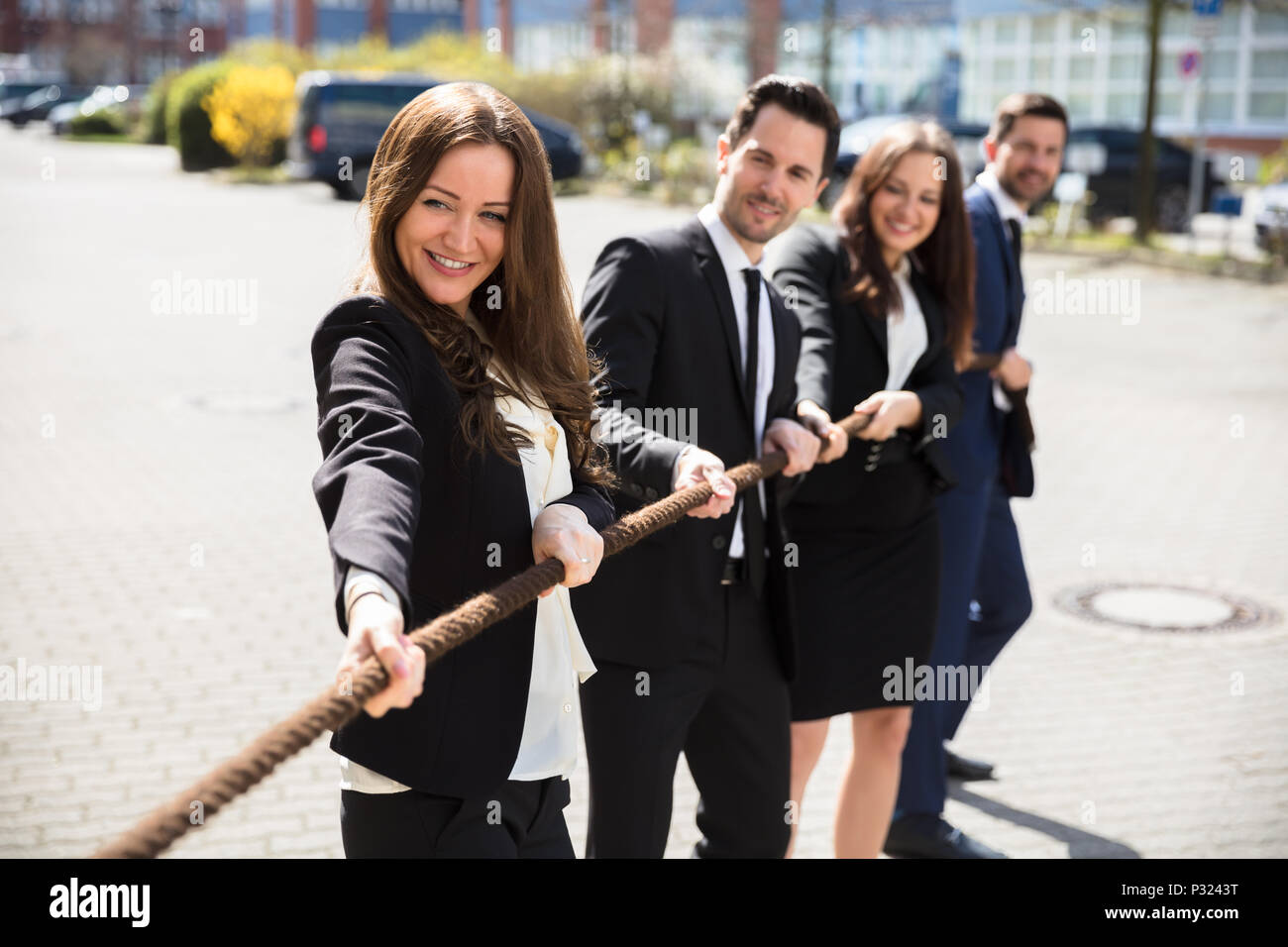 Woman pulling tie hi-res stock photography and images - Alamy