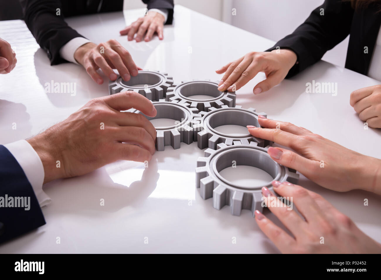 Business people teamwork gear together hi-res stock photography and ...