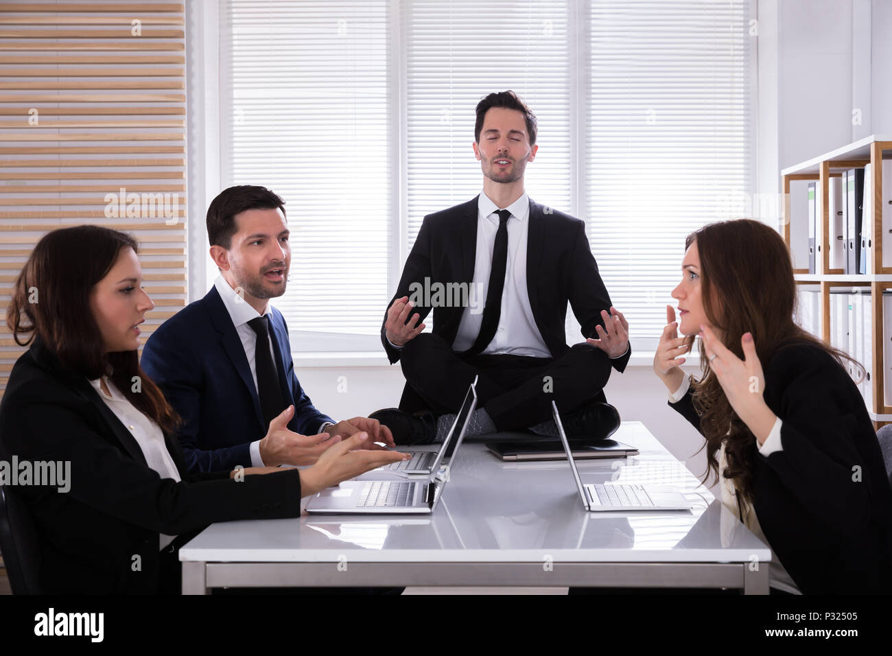 Group lotus pose in office hi-res stock photography and images - Alamy