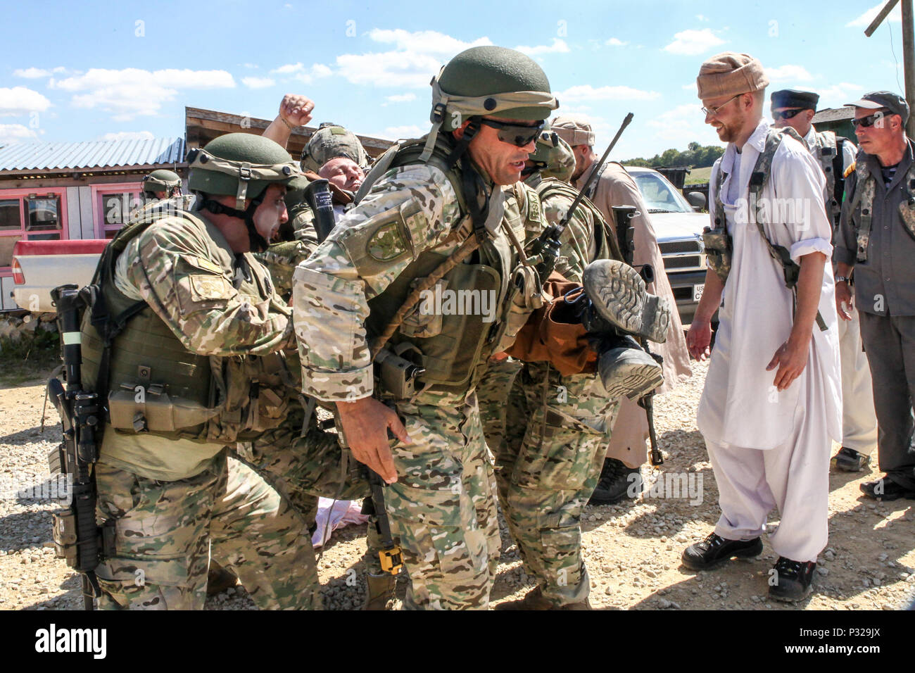 Georgian soldiers of Alpha Company, 32nd Infantry Battalion carries a ...