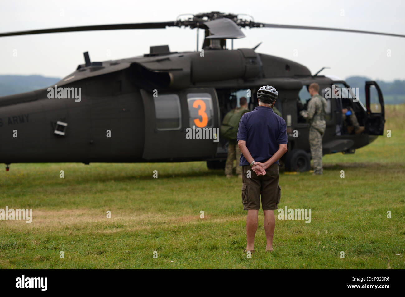 A local German citizen observes as U.S. Soldiers, assigned to Special ...