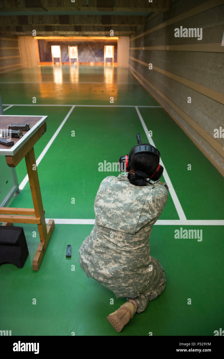 A U.S. Soldier with 650th Military Intelligence Group fires her ...
