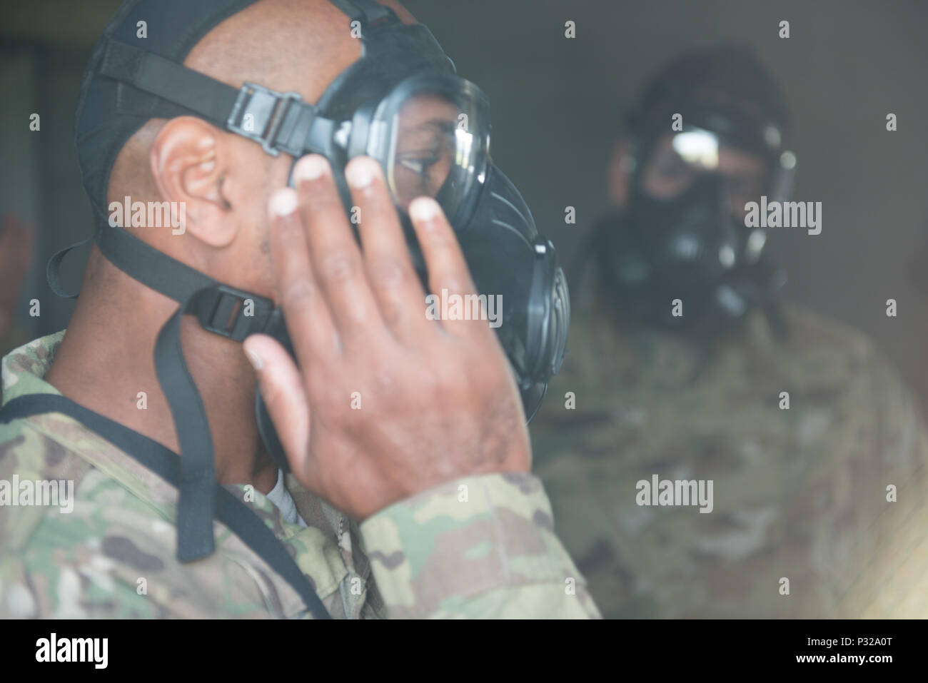 A U.S. Soldier with 650th Military Intelligence Group checks the proper ...
