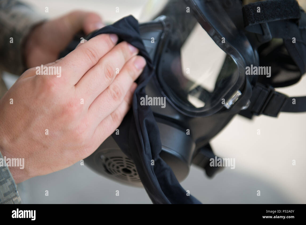 A U.S. Soldier with 650th Military Intelligence Group cleans his M50 ...