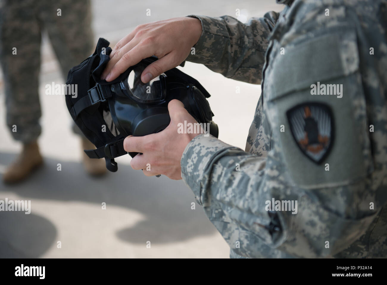 A U.S. Soldier with 650th Military Intelligence Group cleans his M50 ...