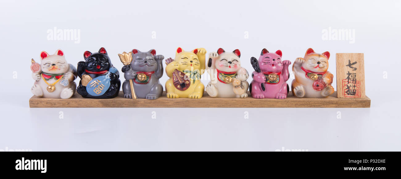 Maneki neko cats. Traditional Japanese souvenir set Stock Photo - Alamy