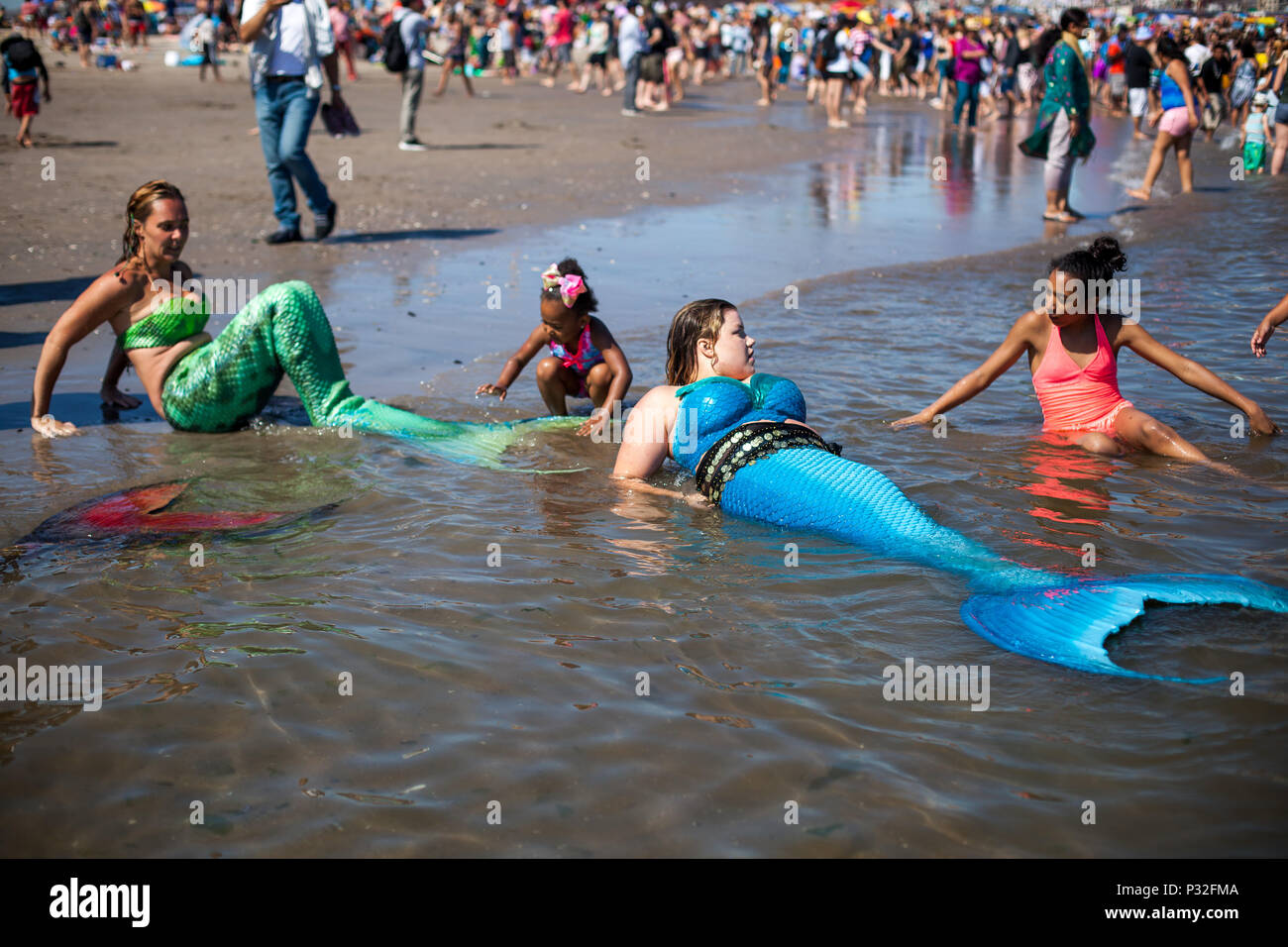 New York, USA. 16th June, 2018. "Mermaids" are seen in the sea during ...