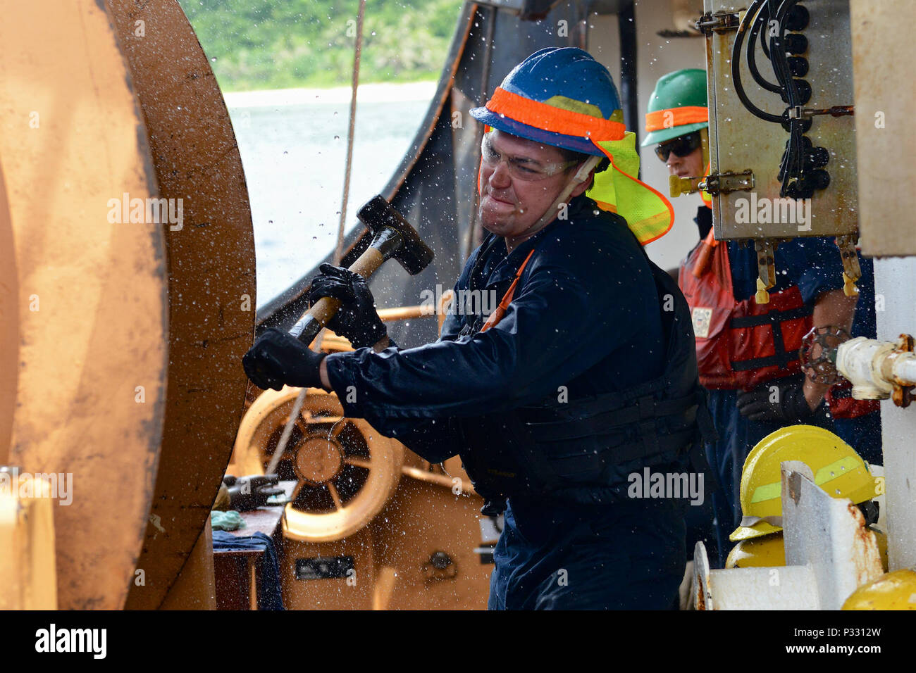 Petty Officer 3rd Class Peter Ritchel, a damage controlman aboard the ...