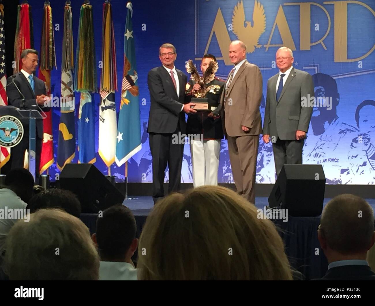 Secretary of Defense Ash Carter (left) presents the 2016 Freedom Award ...