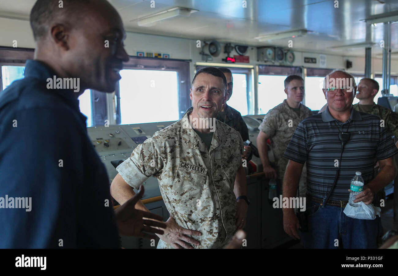 Fred Walley, left, Captain of the SS Wright (T-AVB 3) speaks to Brig ...