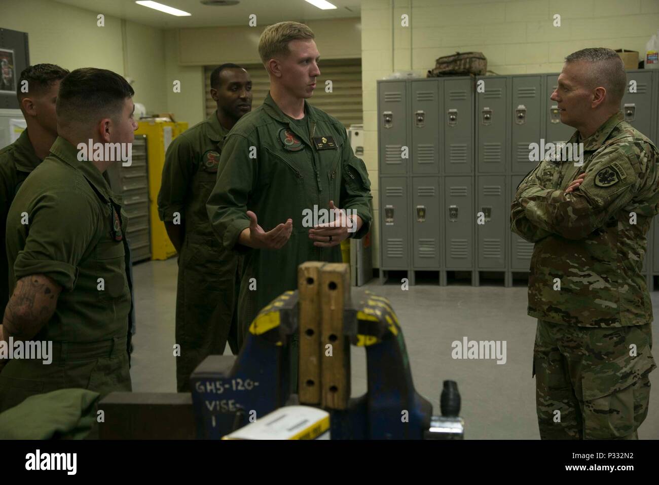 Command Sgt. Maj. John W. Troxell, far right, listens to Marines ...