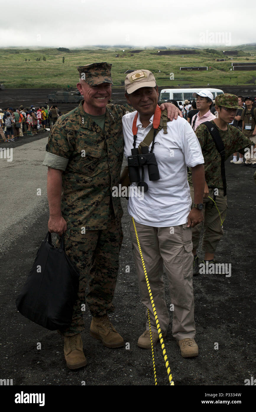 Lt. Gen. Larry Nicholson poses for a photo with an attendee of the ...