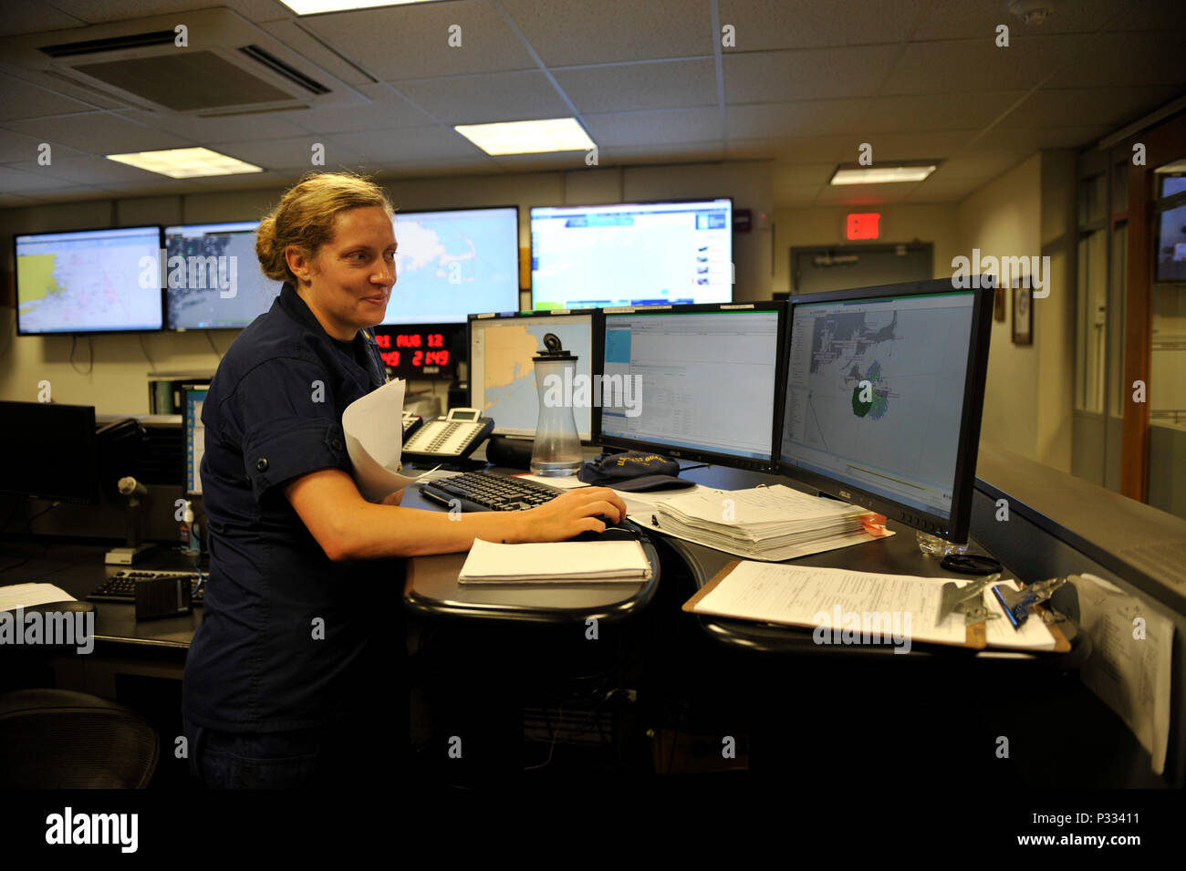 Petty Officer 2nd Class Michelle Crocker inputs coordinates into SAROPS ...