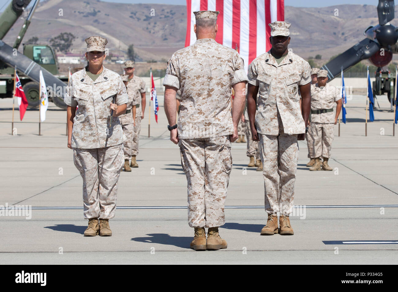 U.S. Marine Corps Sgt. Maj. Karyl J. Sisneros (left), Col. Ian R. Clark ...