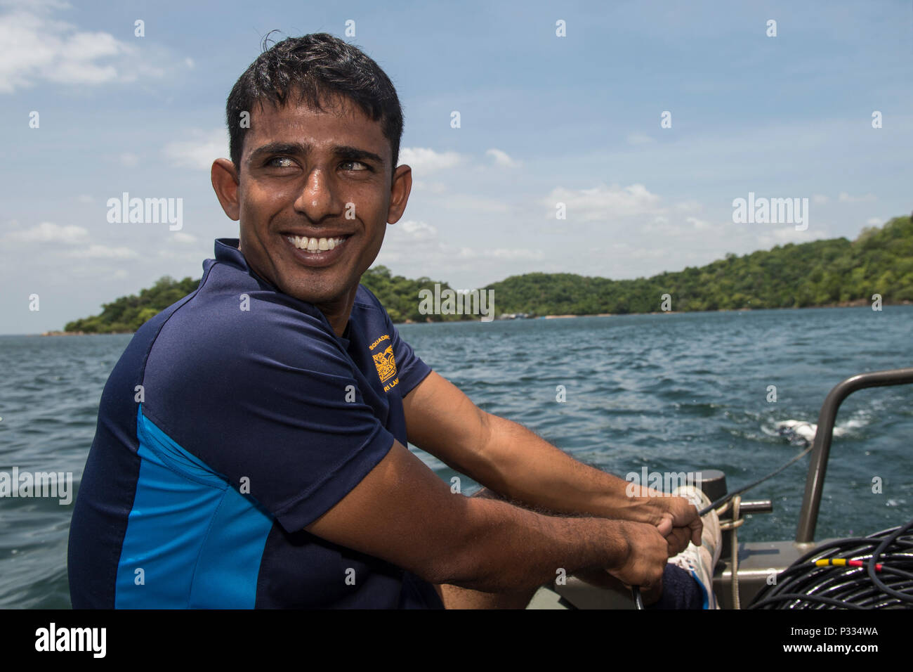 A Sri Lankan Navy diver tends a side-scan sonar system during Sri Lanka ...