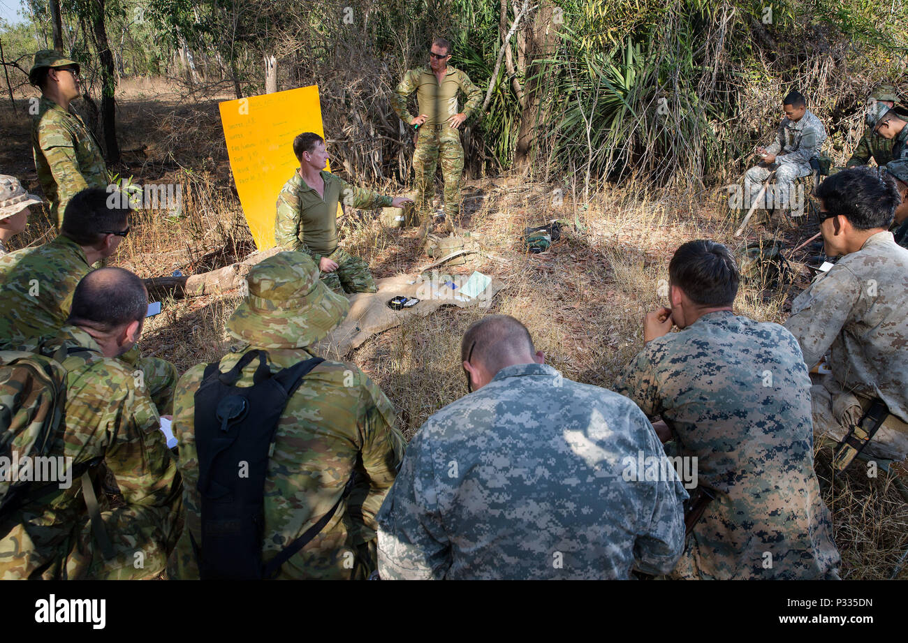 Australian Army Sgt. Steve Ellis, center left, from North-West Mobile ...
