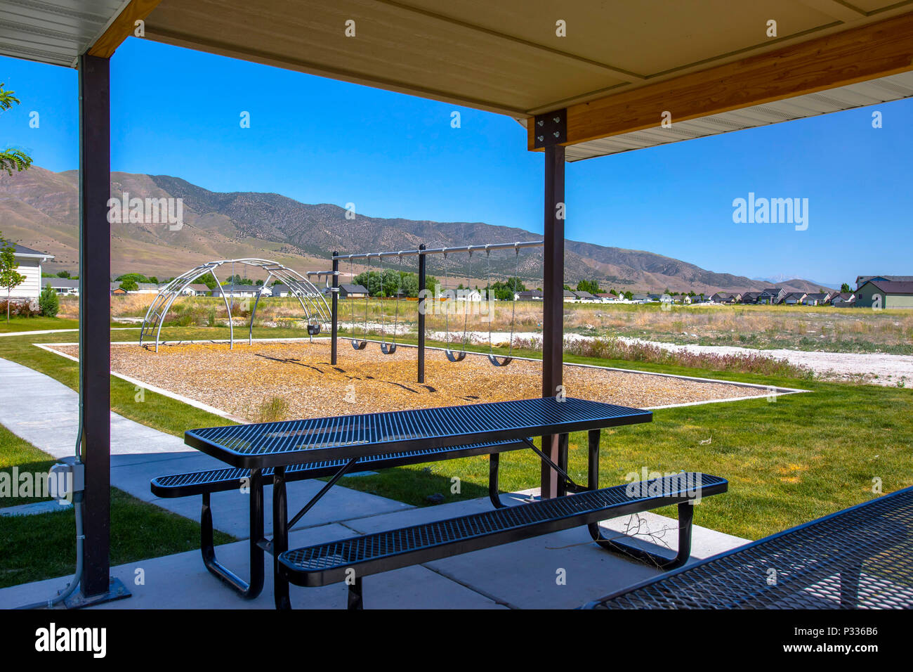 Seating area at small playground in Utah Valley Stock Photo - Alamy