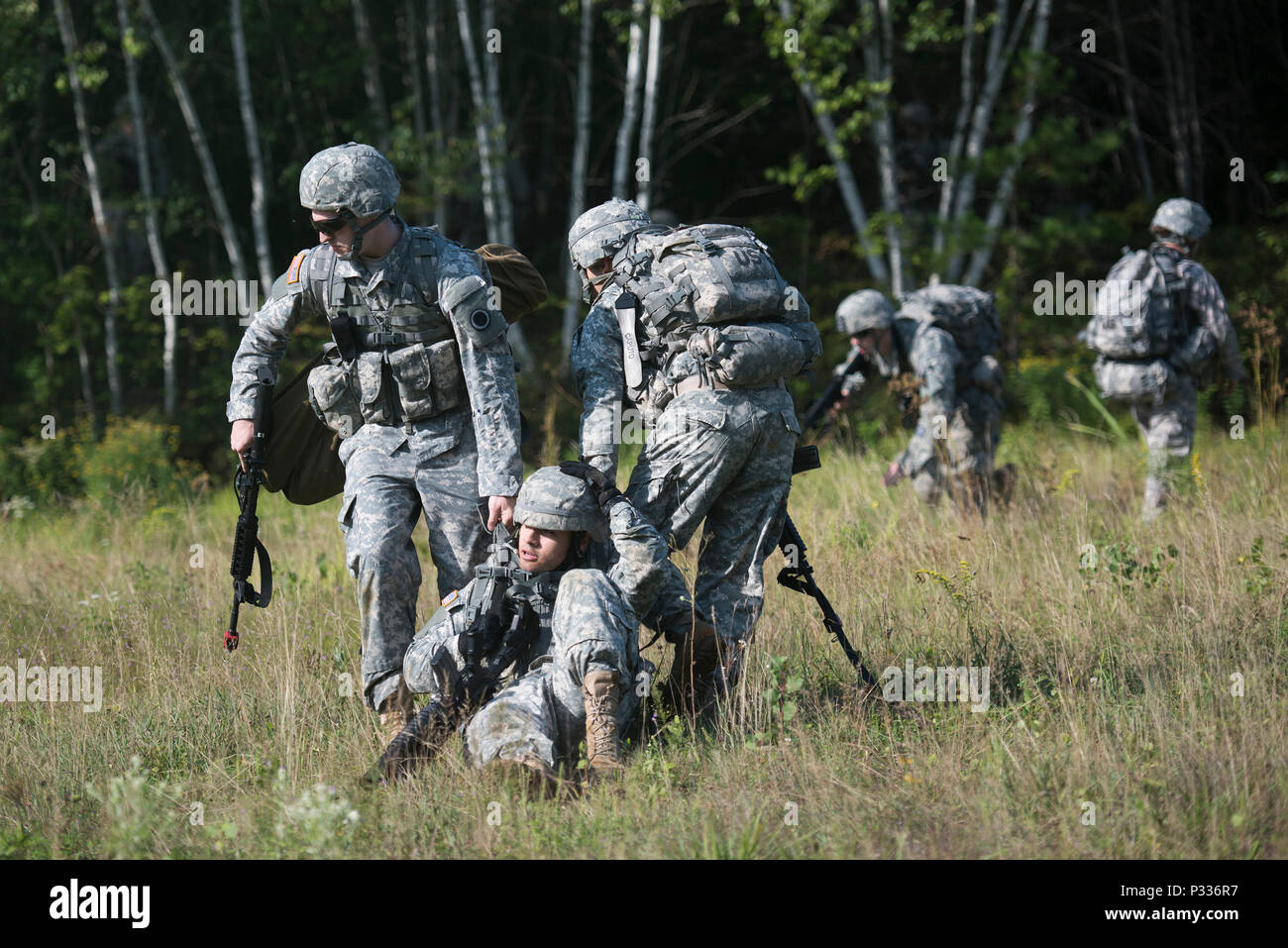 U.S. Soldiers evacuate a simulated casualty during a Situational ...