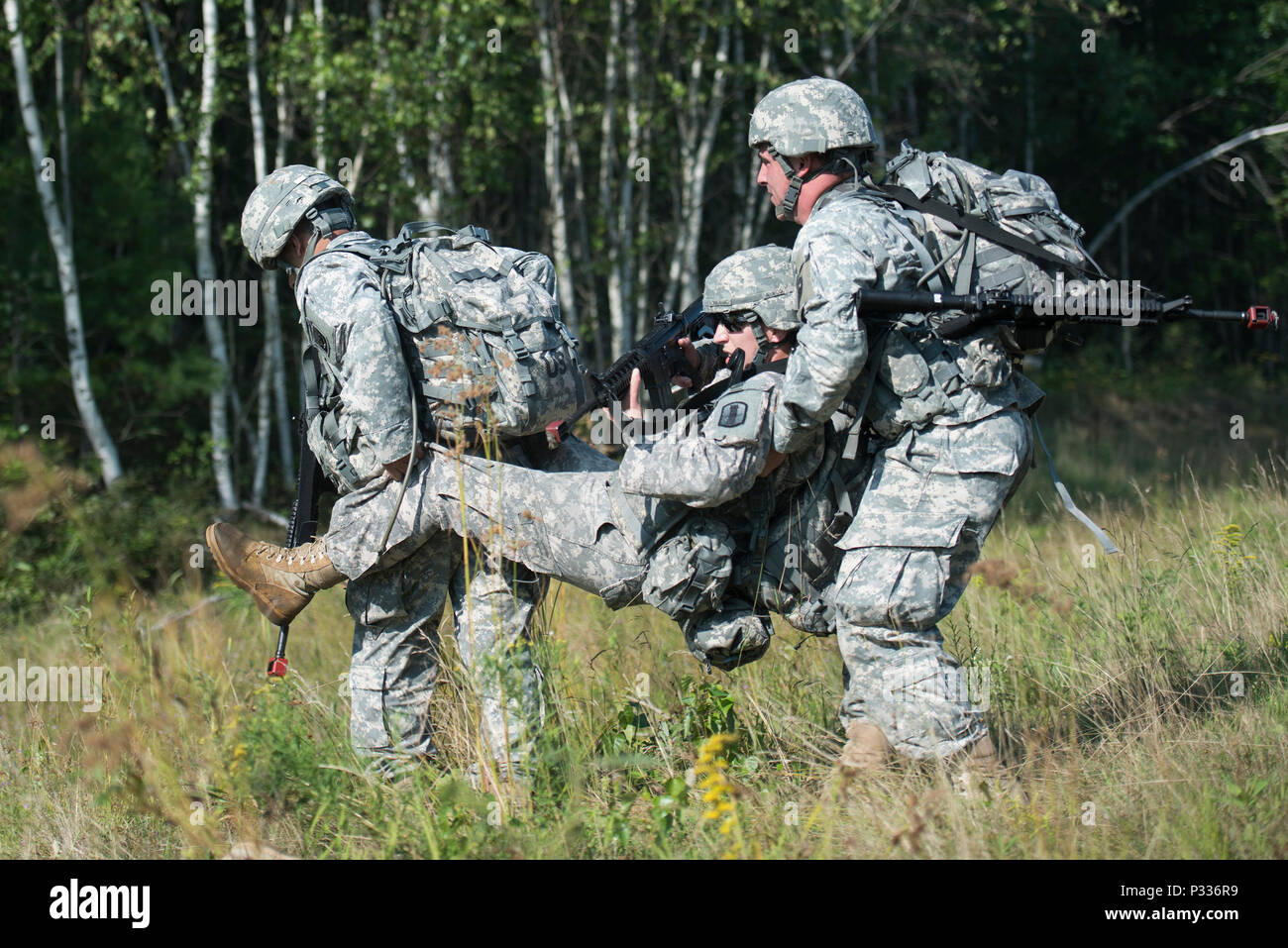 U.S. Soldiers evacuate a simulated casualty during a Situational ...