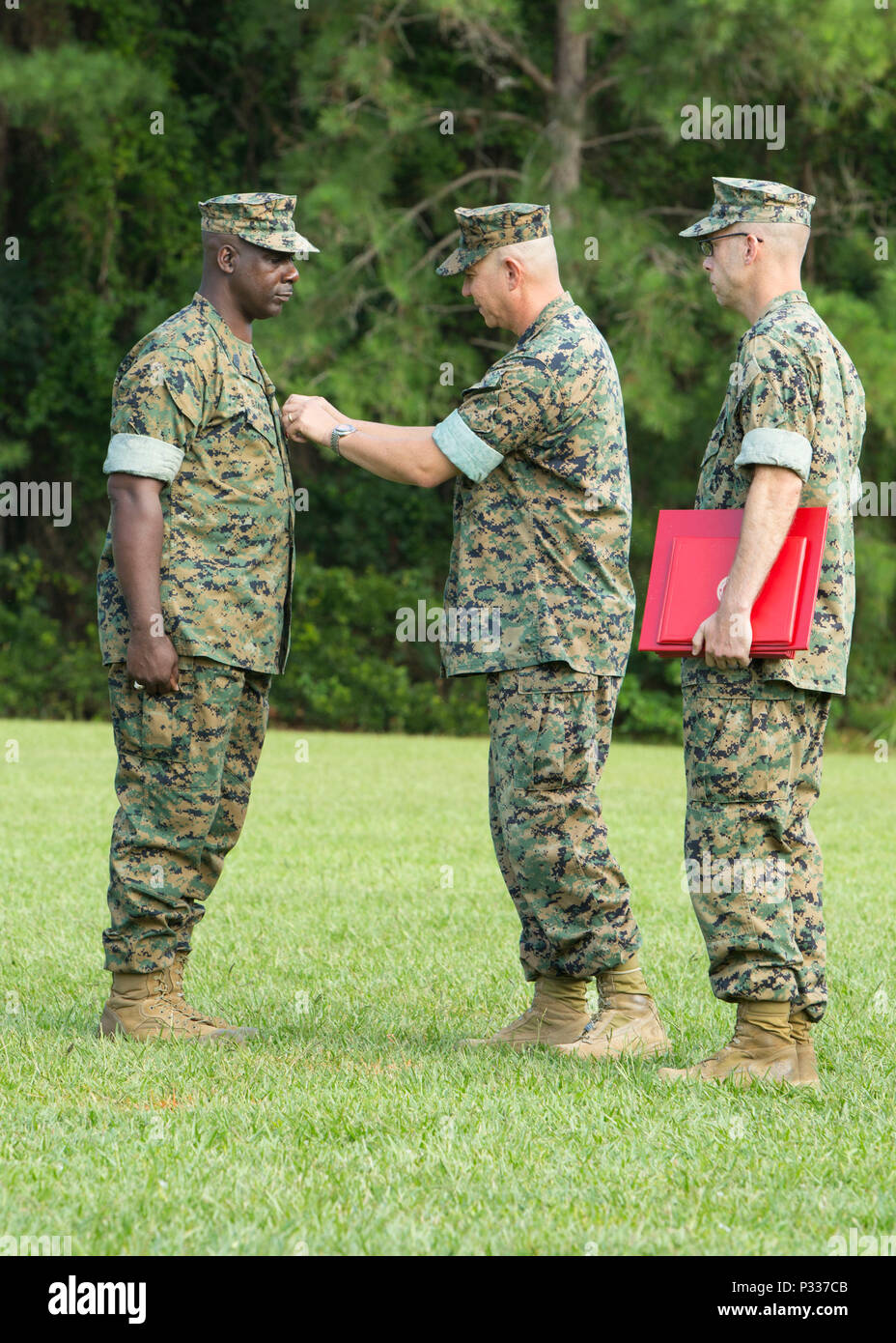 U.S. Marine Corps Master Gunnery Sgt. James Stanley, left, operations ...