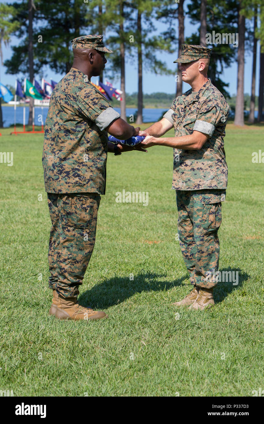 U.S. Marine Corps Master Gunnery Sgt. James Stanley, left, receives an ...