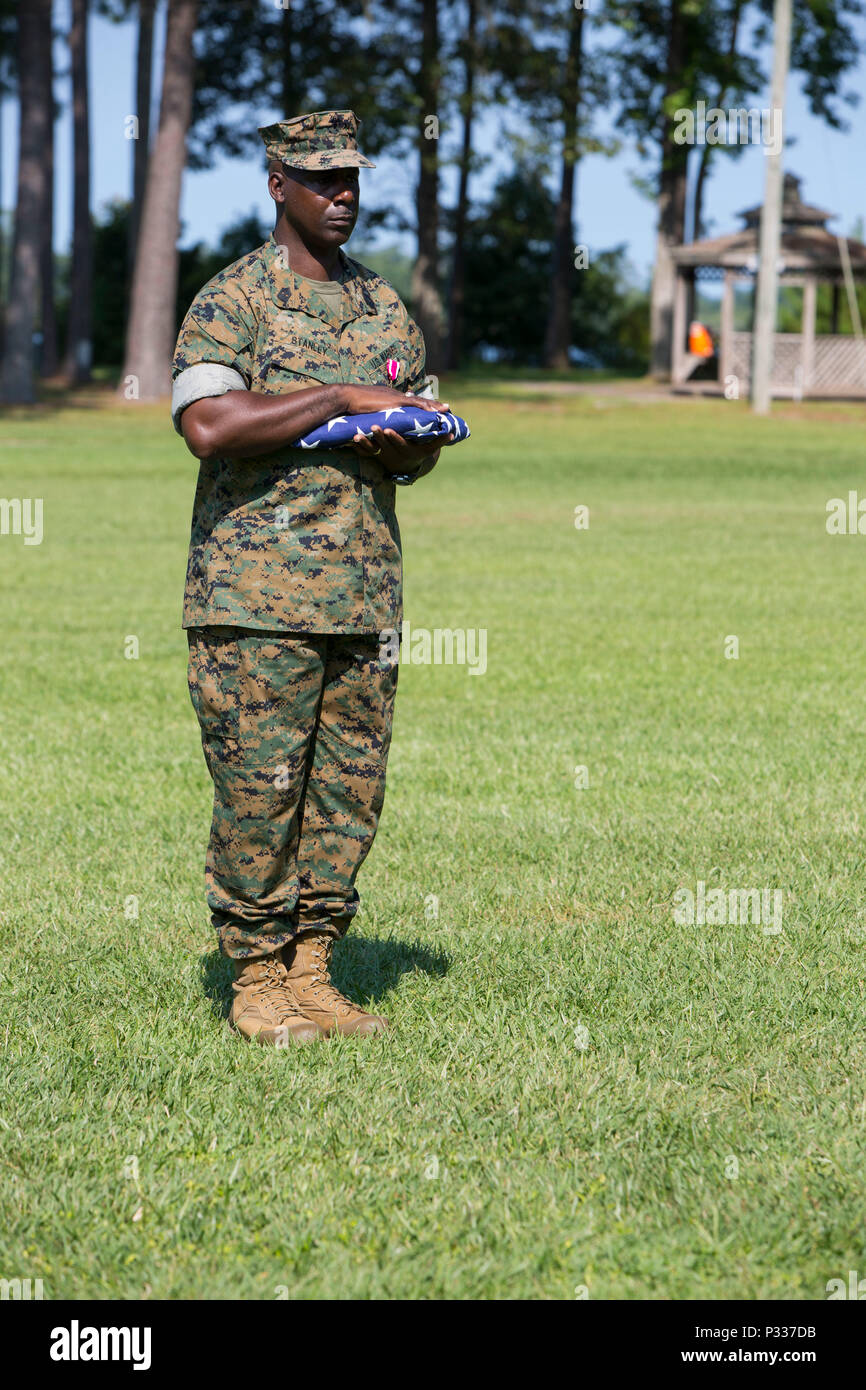 U.S. Marine Corps Master Gunnery Sgt. James Stanley stands at attention ...