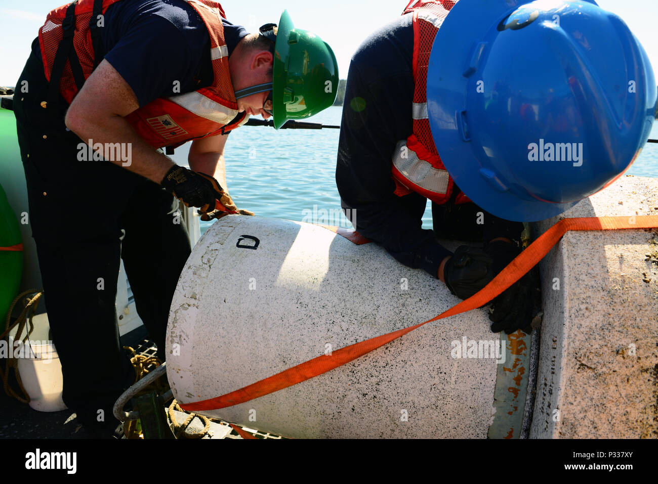 Coast Guard Petty Officer 3rd Class Daniel Schoonover and Petty Officer ...