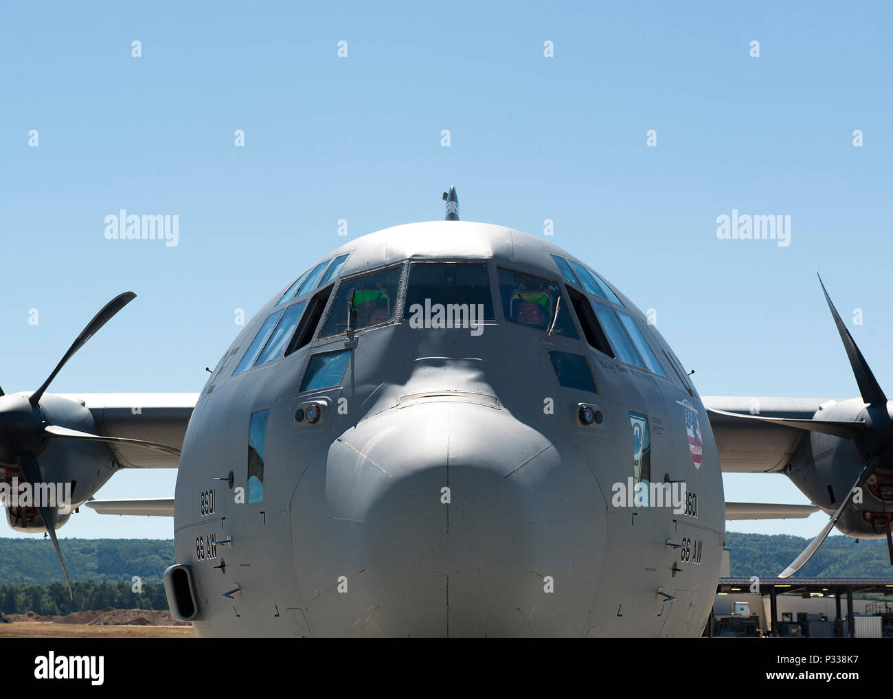 Brig. Gen. Richard Moore, 86th Airlift Wing commander, looks out the ...