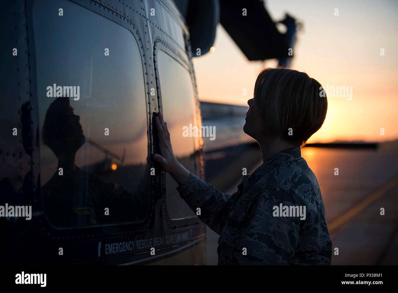 Capt. Sarah Morris, 11th Wing chaplain, blesses a UH-1N Huey on the ...
