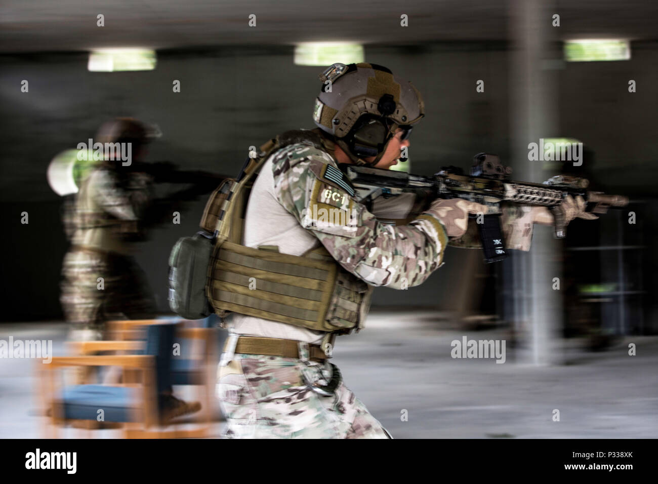 Special forces Soldiers, 1st Battalion, 10th Special Forces group clear ...