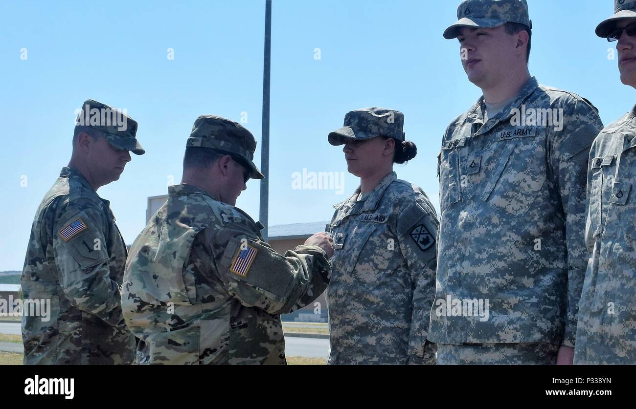 Samantha Guilliams (center right), a military police soldier with the ...