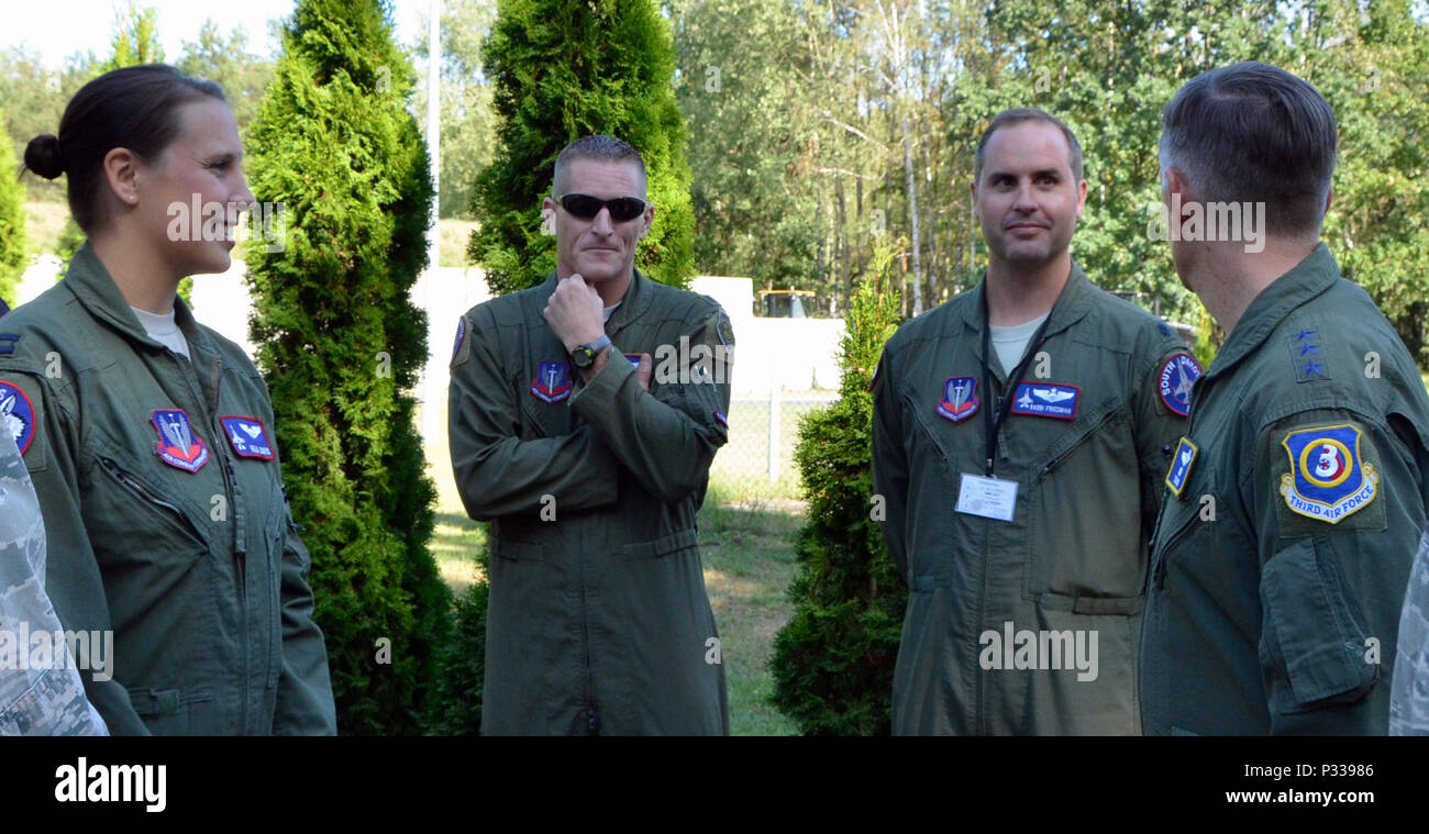 Lask Air Base, Poland -- Capt. Shanon Davis, left, 175th Fighter ...