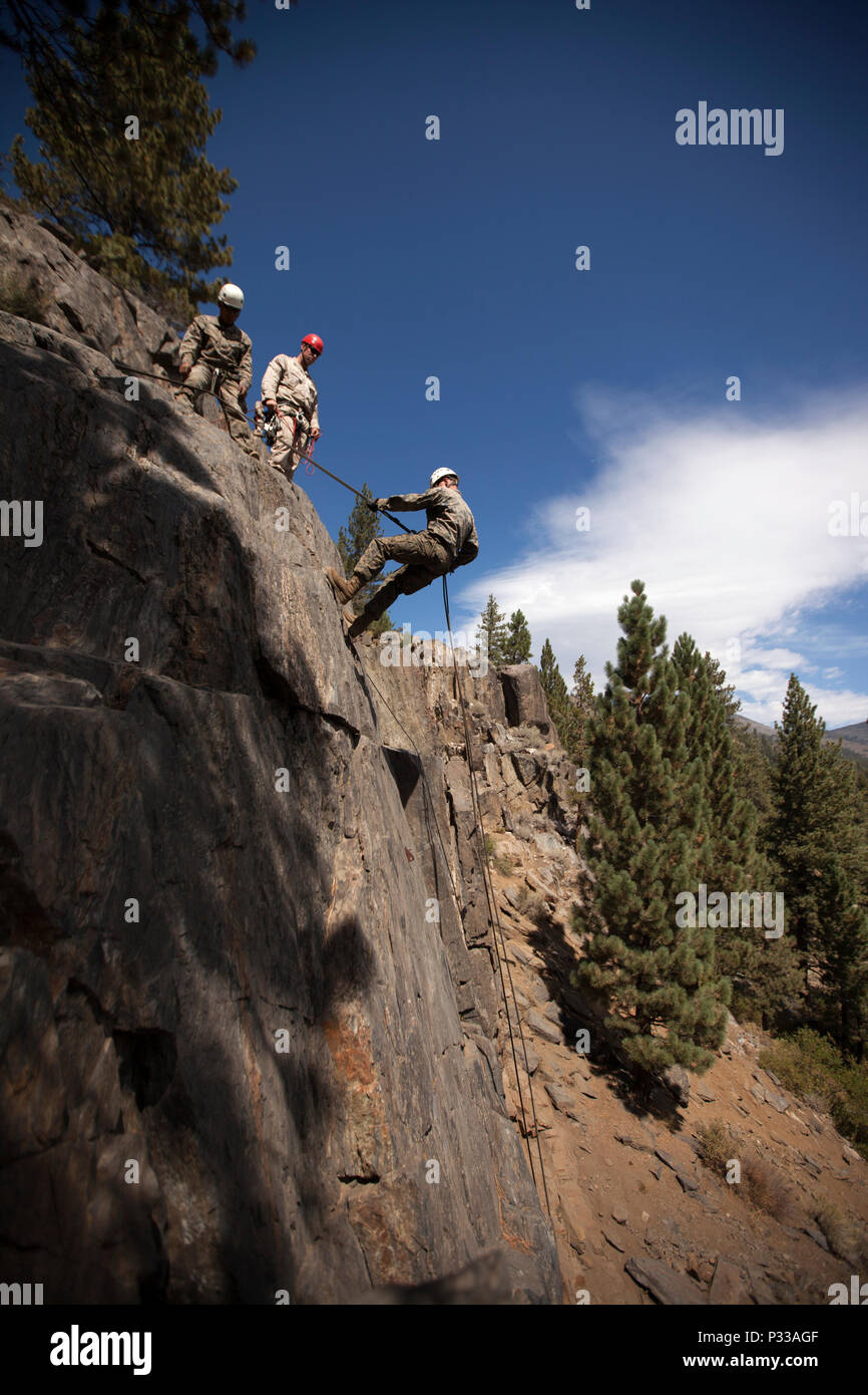 A Marine with 3rd Battalion, 8th Marine Regiment, self-belays down a ...
