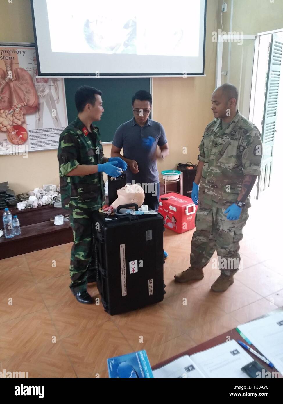 A Vietnamese army student instructs the medical class on how to ...