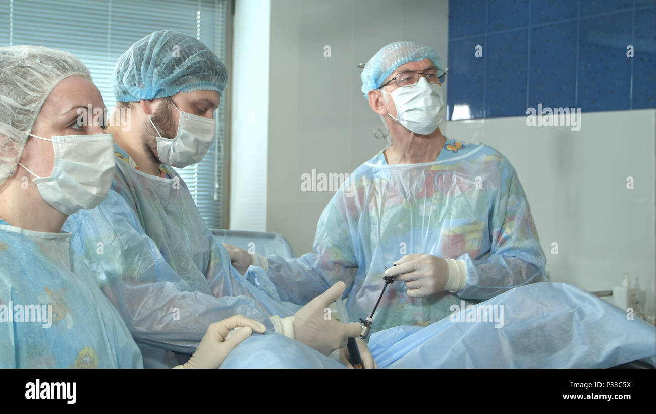 Medical staff in the opearing room doing sucessful surgical procedure ...
