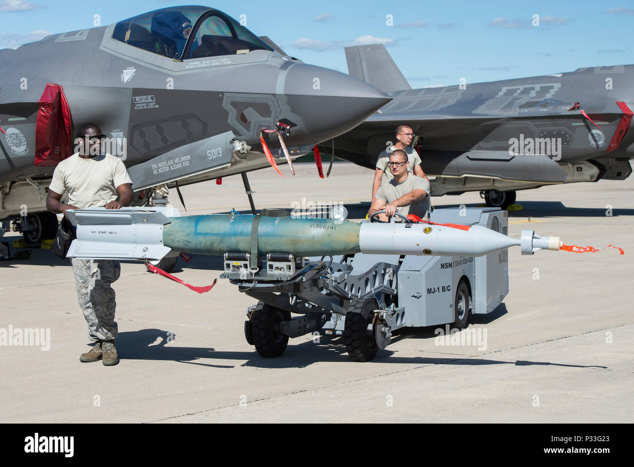 58th Aircraft Maintenance Unit weapons load crew members unload a GBU ...