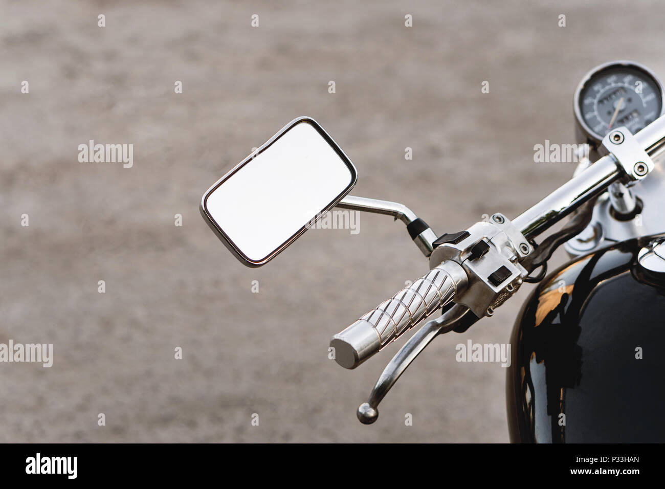 Motorcycle steering close-up. Speedometer, gas tank and brake handle in ...